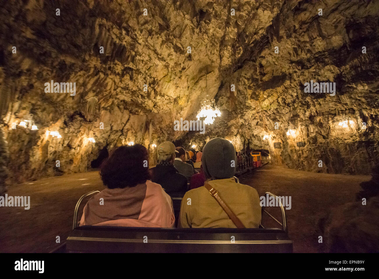 the entrance with a small train in Postojna caves Stock Photo - Alamy
