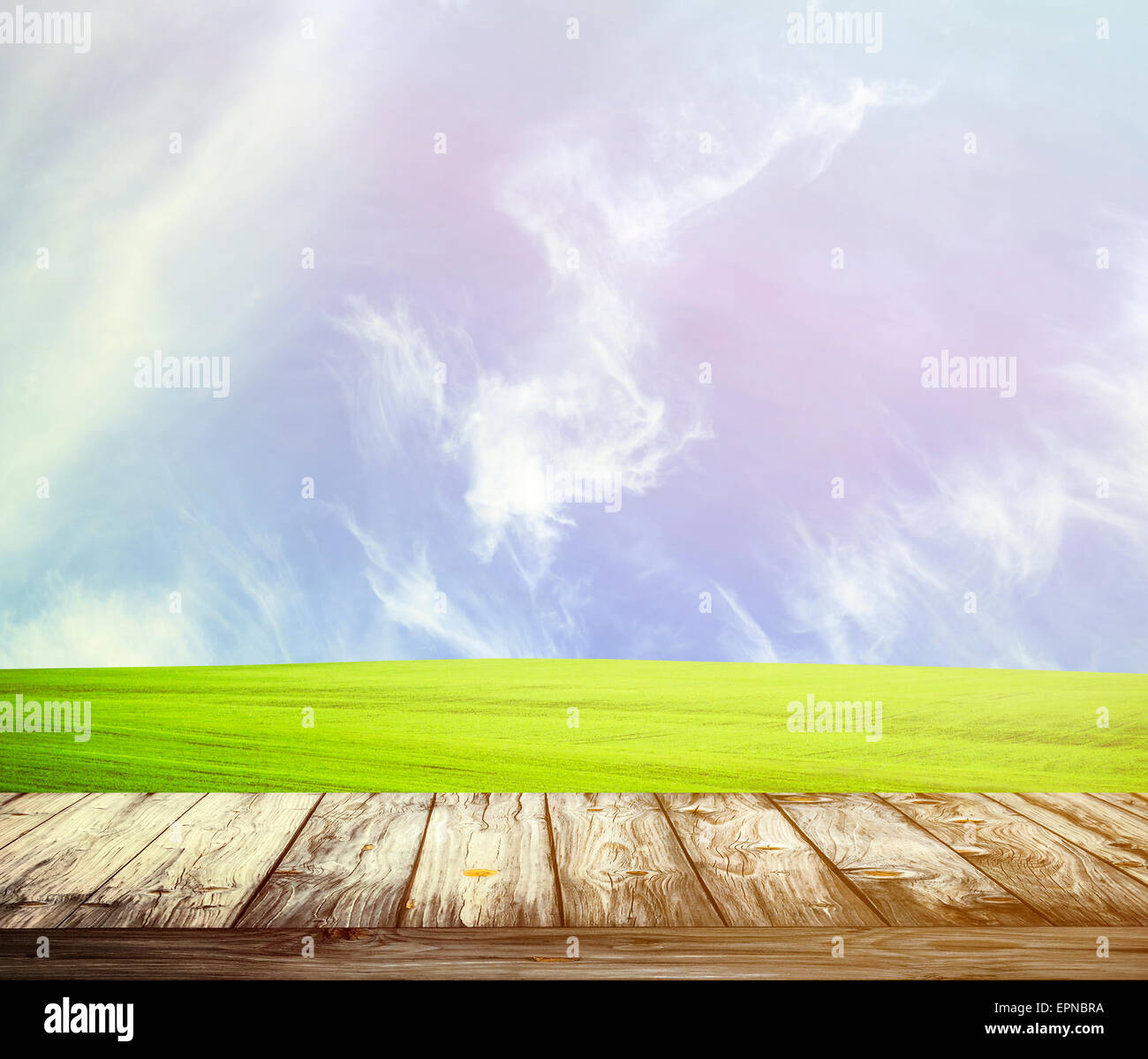 Fresh spring green grass with blue sky and wooden floor Stock Photo - Alamy