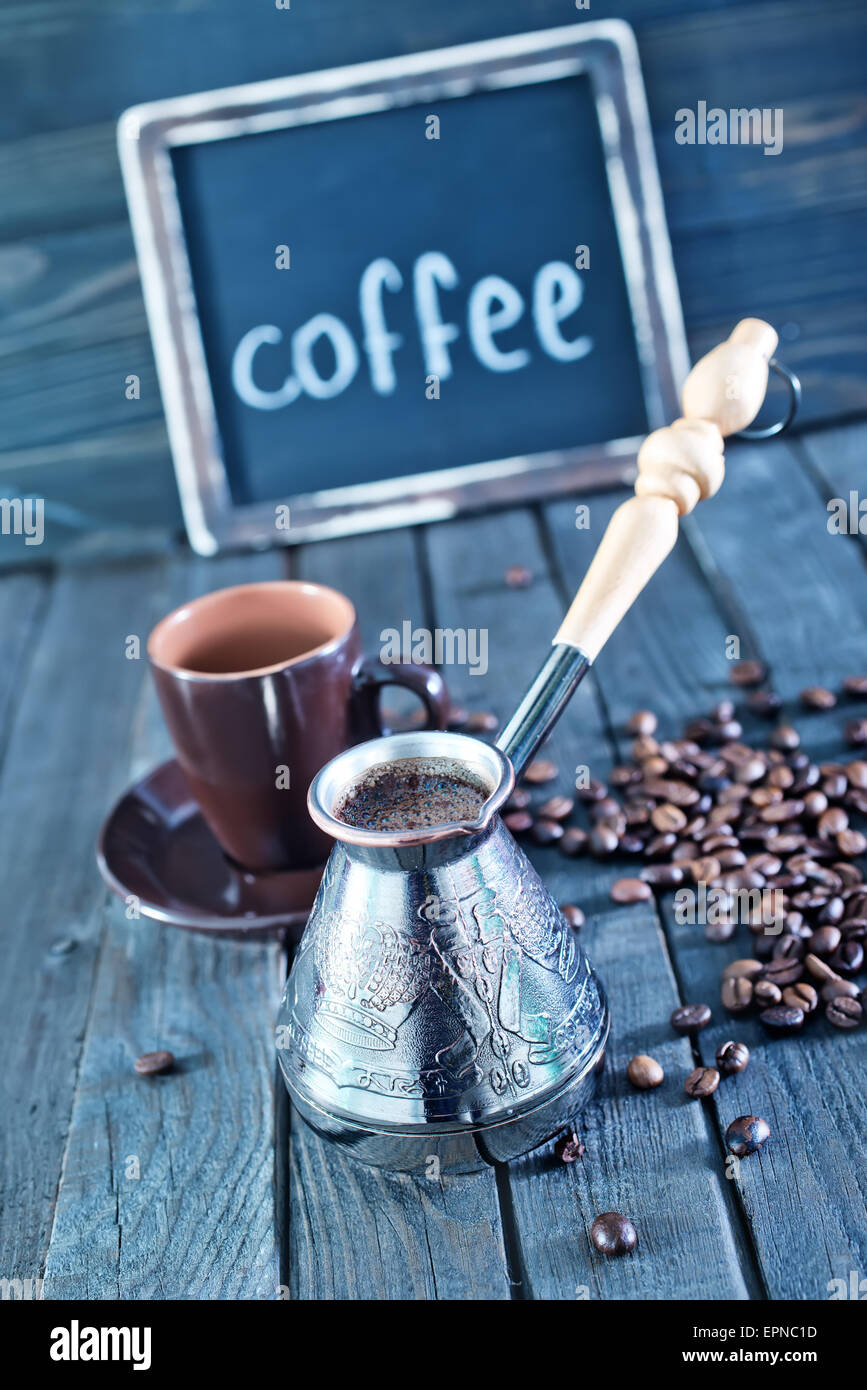coffee beans on the wooden table, coffee background Stock Photo - Alamy