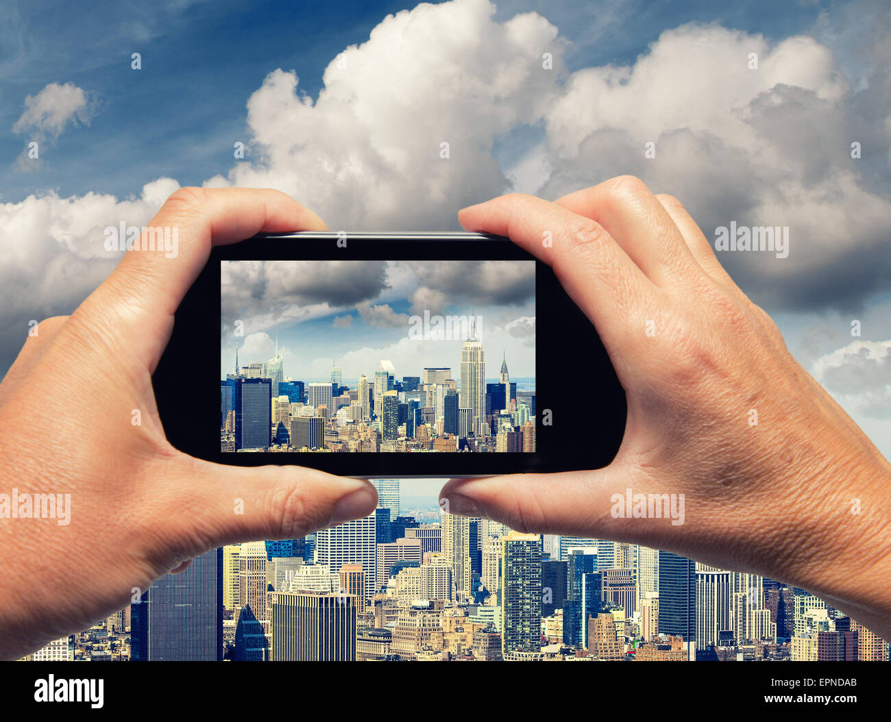 Man and woman hand capturing New York City skyline with smartphone ...