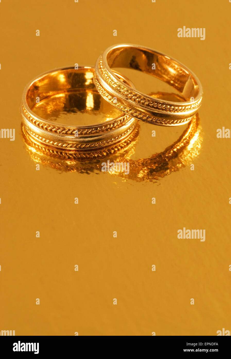 Two golden wedding rings Stock Photo - Alamy