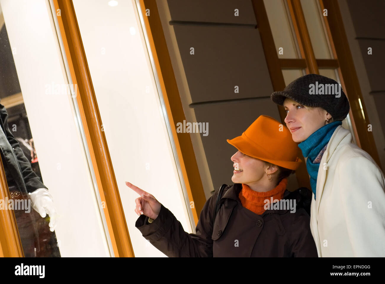 Two girls near the shop window Stock Photo - Alamy