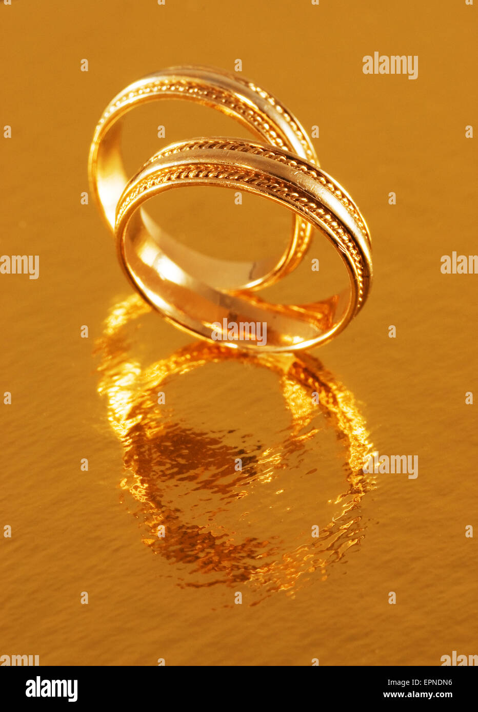 Two golden wedding rings Stock Photo - Alamy