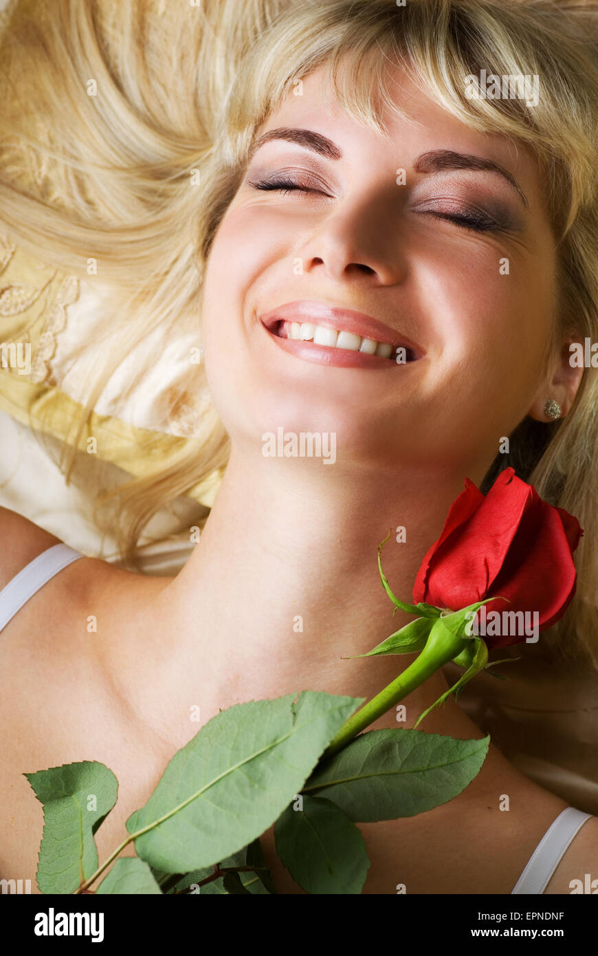 Young beautiful woman with red rose Stock Photo - Alamy