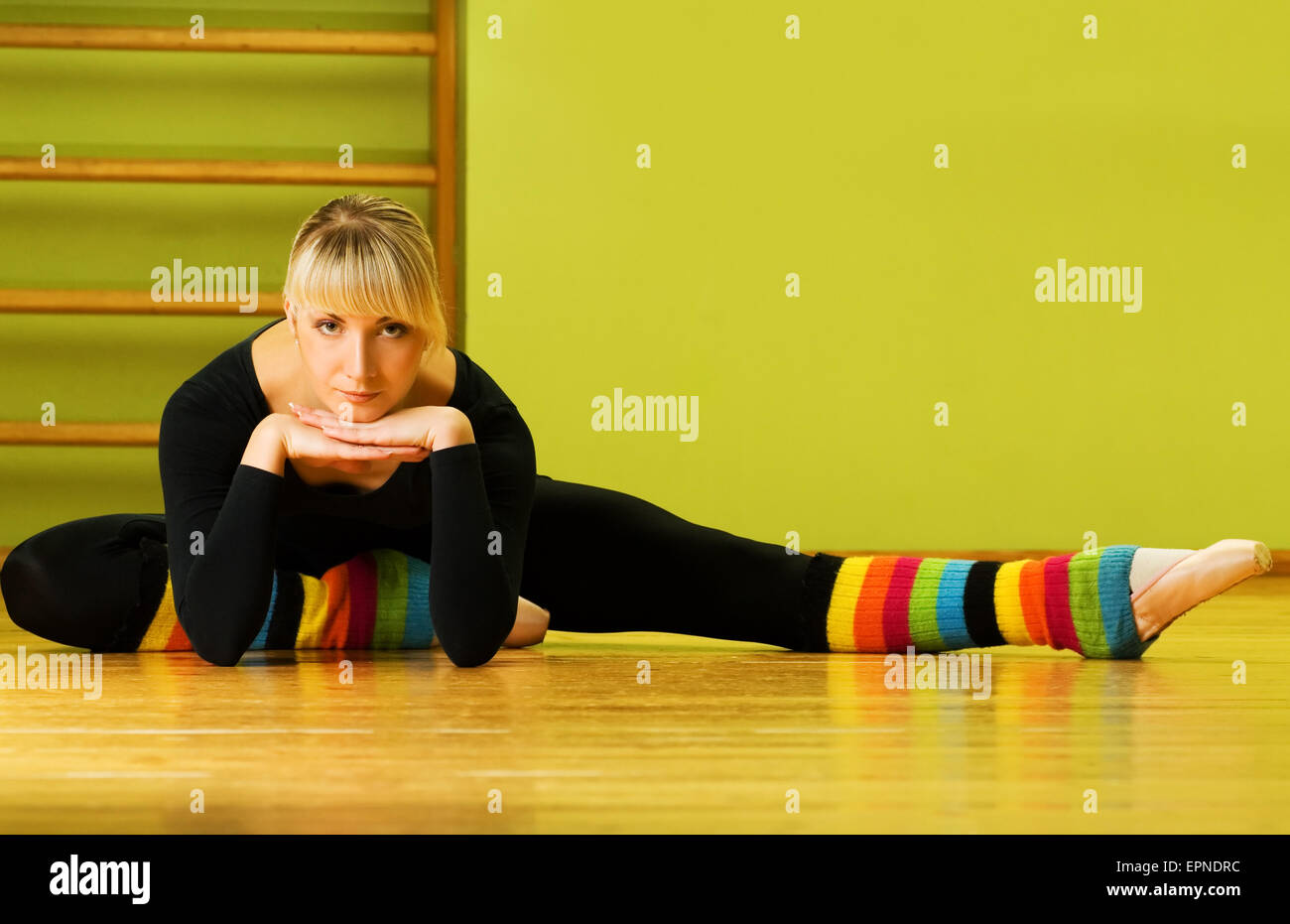 Ballet dancer doing stretching exercise on a floor Stock Photo - Alamy
