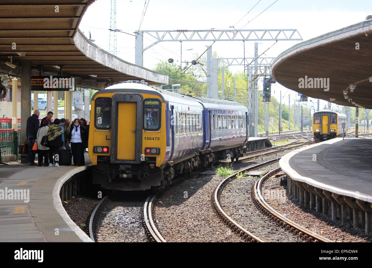Two diesel multiple unit trains at and approaching Carnforth railway ...