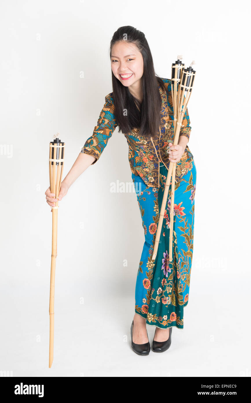 Full Body Portrait Of Southeast Asian Woman In Batik Dress Hands