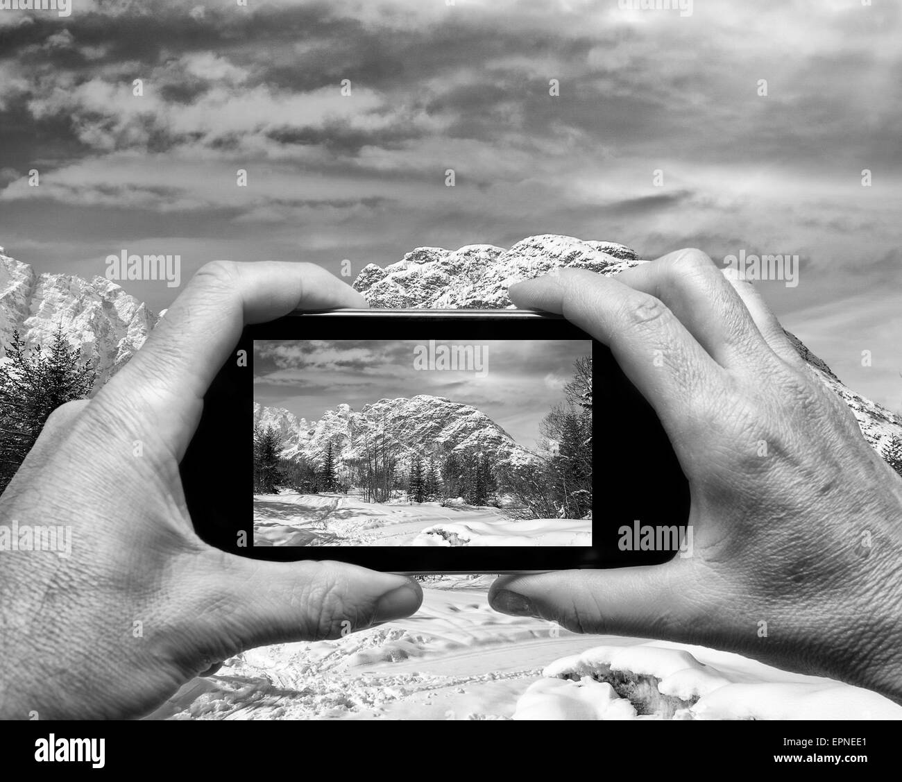 Man and woman hand capturing Alpin Winter landscape with smartphone ...