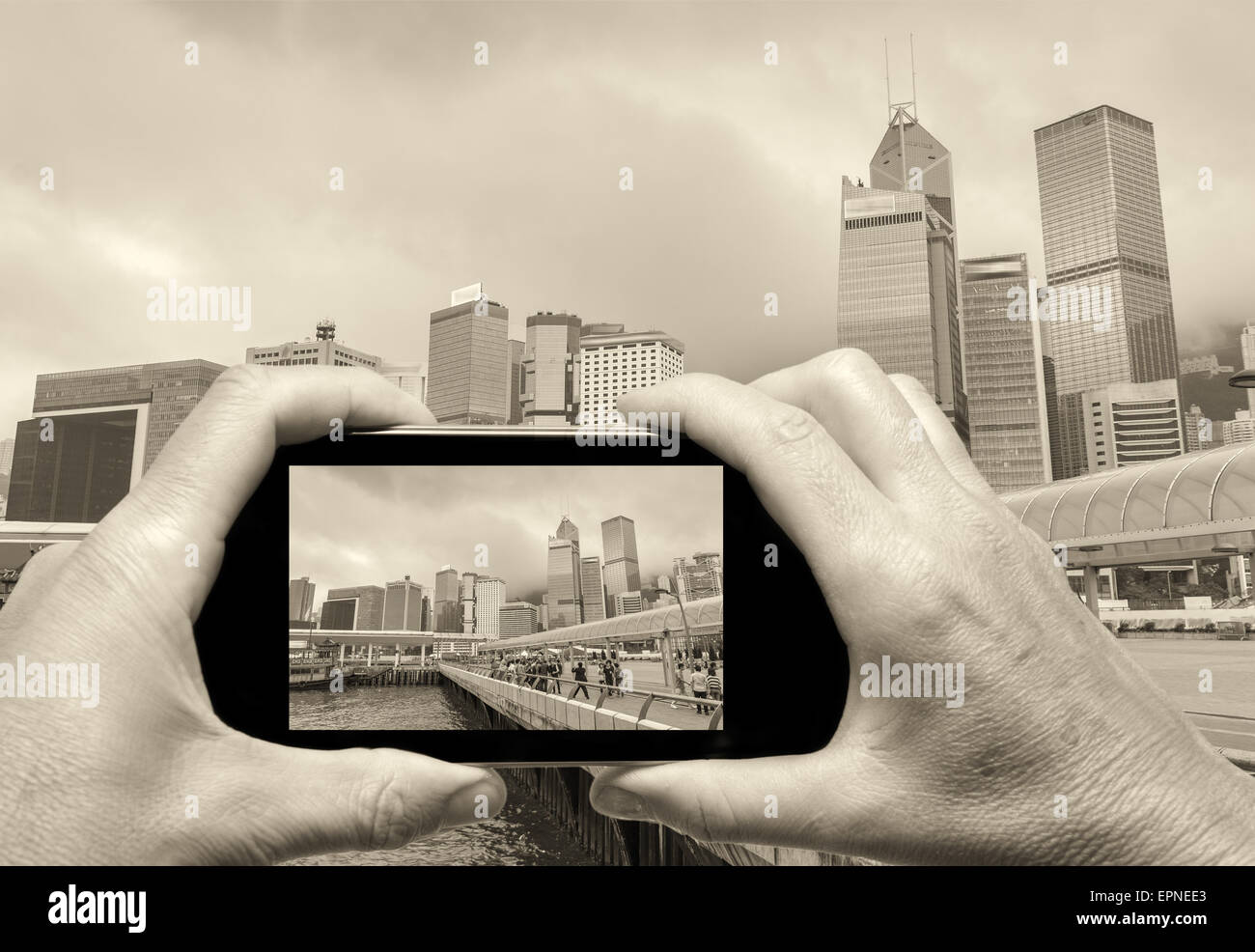 Man and woman hand capturing Hong Kong skyline with smartphone Stock ...