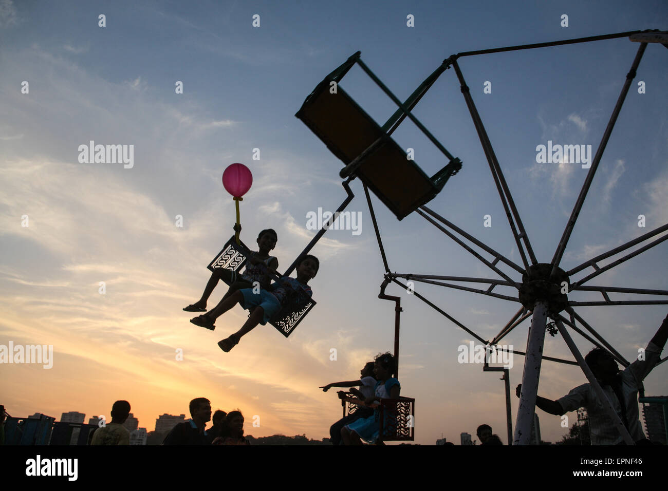 Silhouette Children On Fairground Ride High Resolution Stock ...