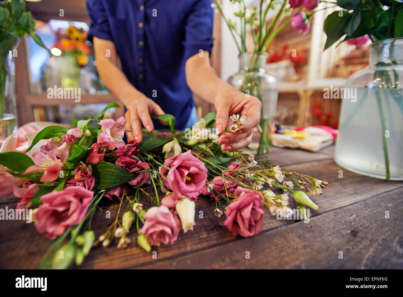 Female florist sorting flowers in workshop Stock Photo - Alamy