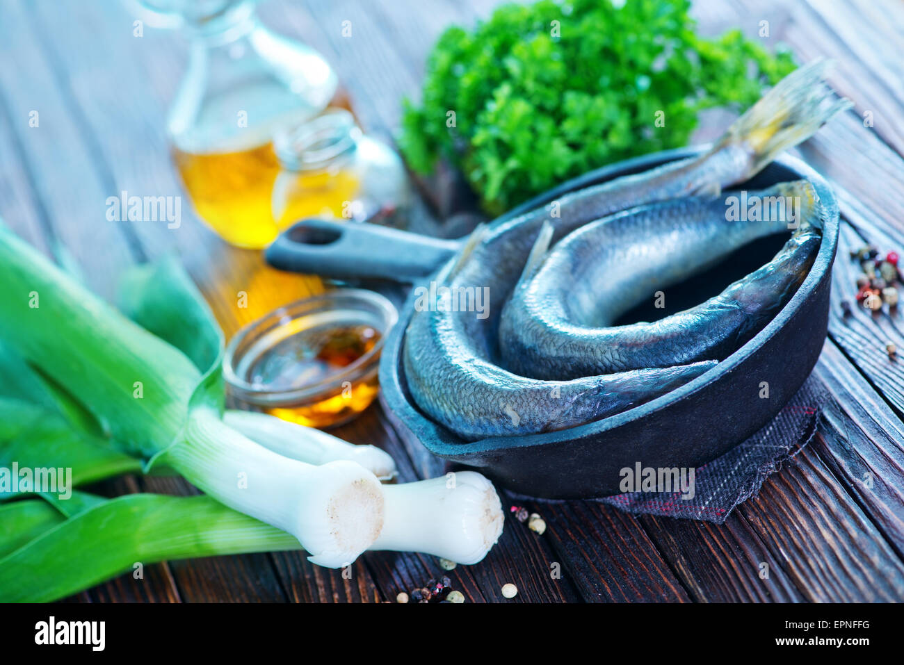raw fish with salt and spice in the pan Stock Photo - Alamy