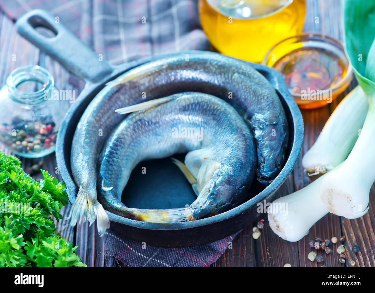 raw fish with salt and spice in the pan Stock Photo - Alamy