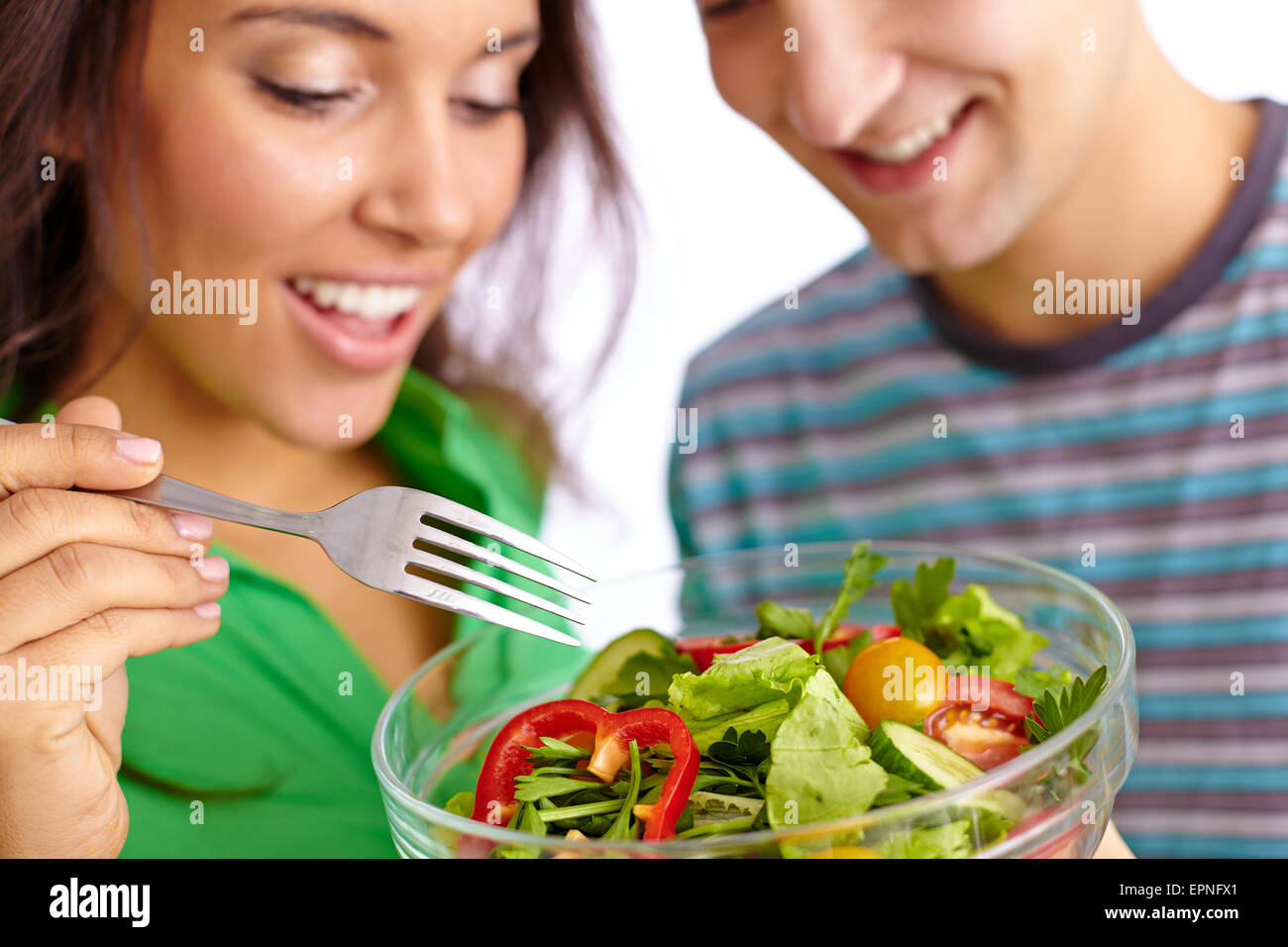 Happy girl and her boyfriend eating fresh vegetable salad Stock Photo ...
