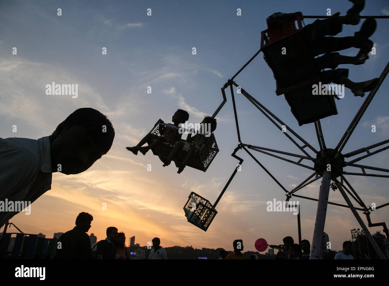 Silhouette Children On Fairground Ride High Resolution Stock ...