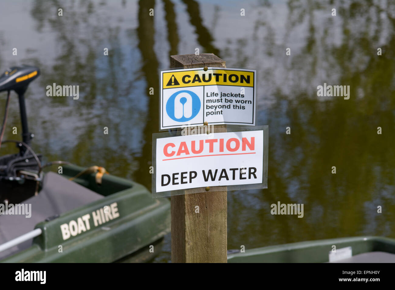 Caution signs besides river - warning of deep water and need for life ...