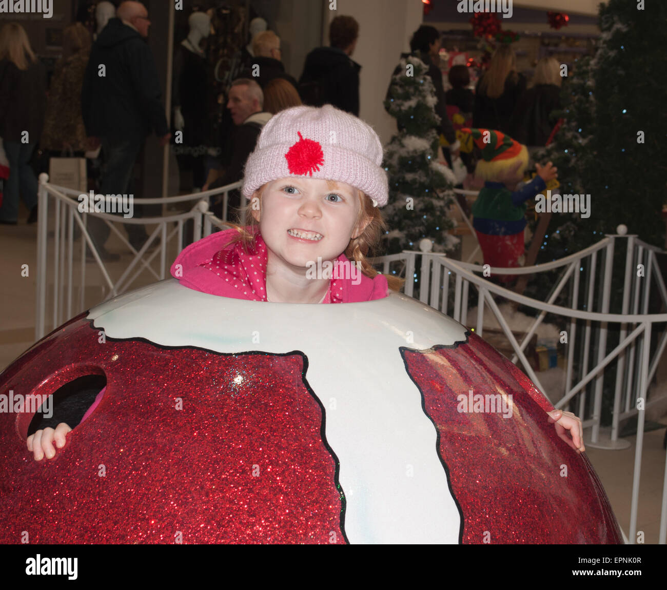 Little girl in a christmas pudding Stock Photo - Alamy