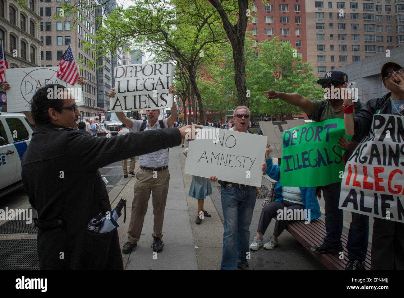 Manhattan, New York, USA. 19th May, 2015. An activist confronts anti ...