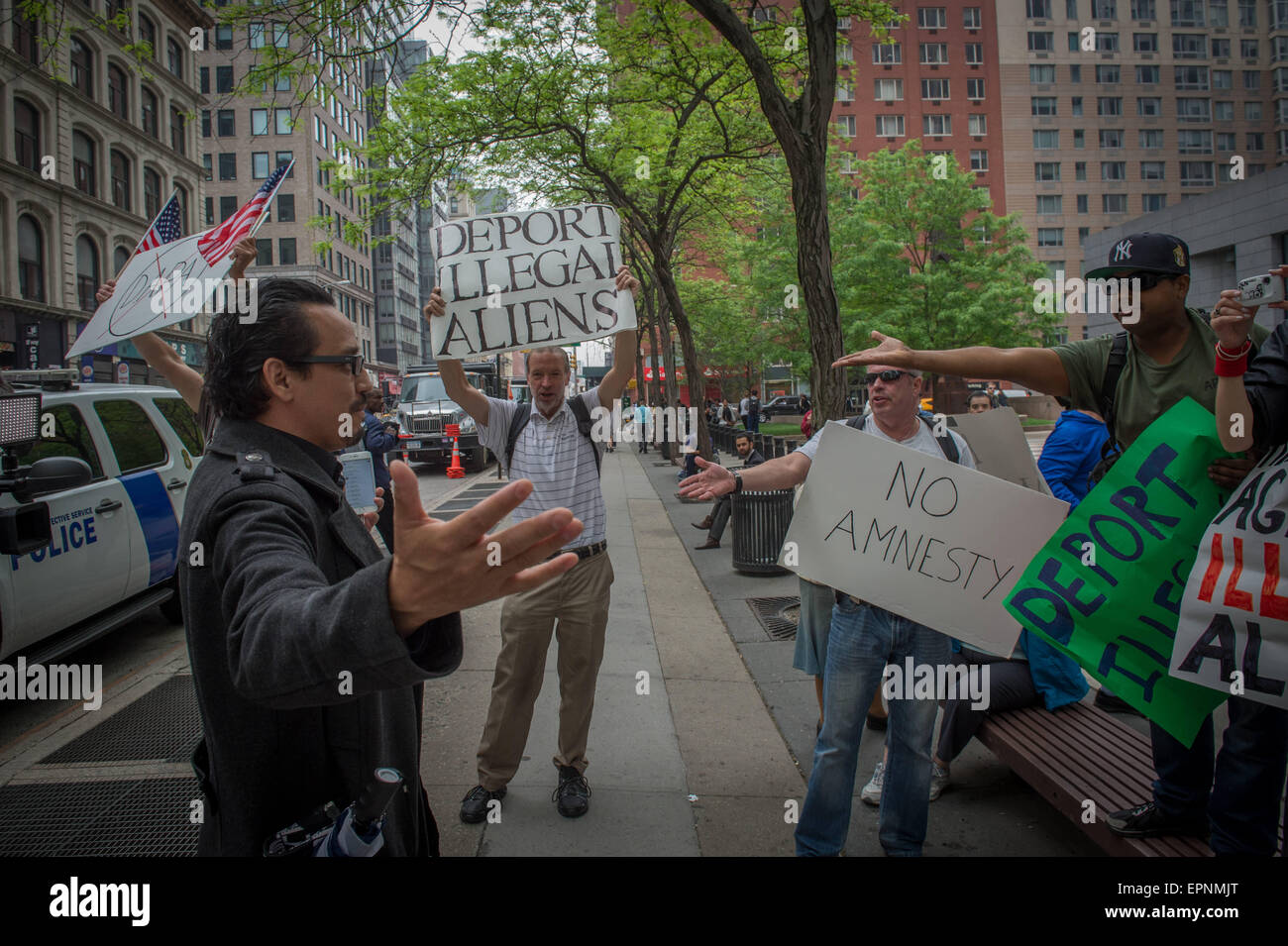 Manhattan, New York, USA. 19th May, 2015. An activist confronts anti ...
