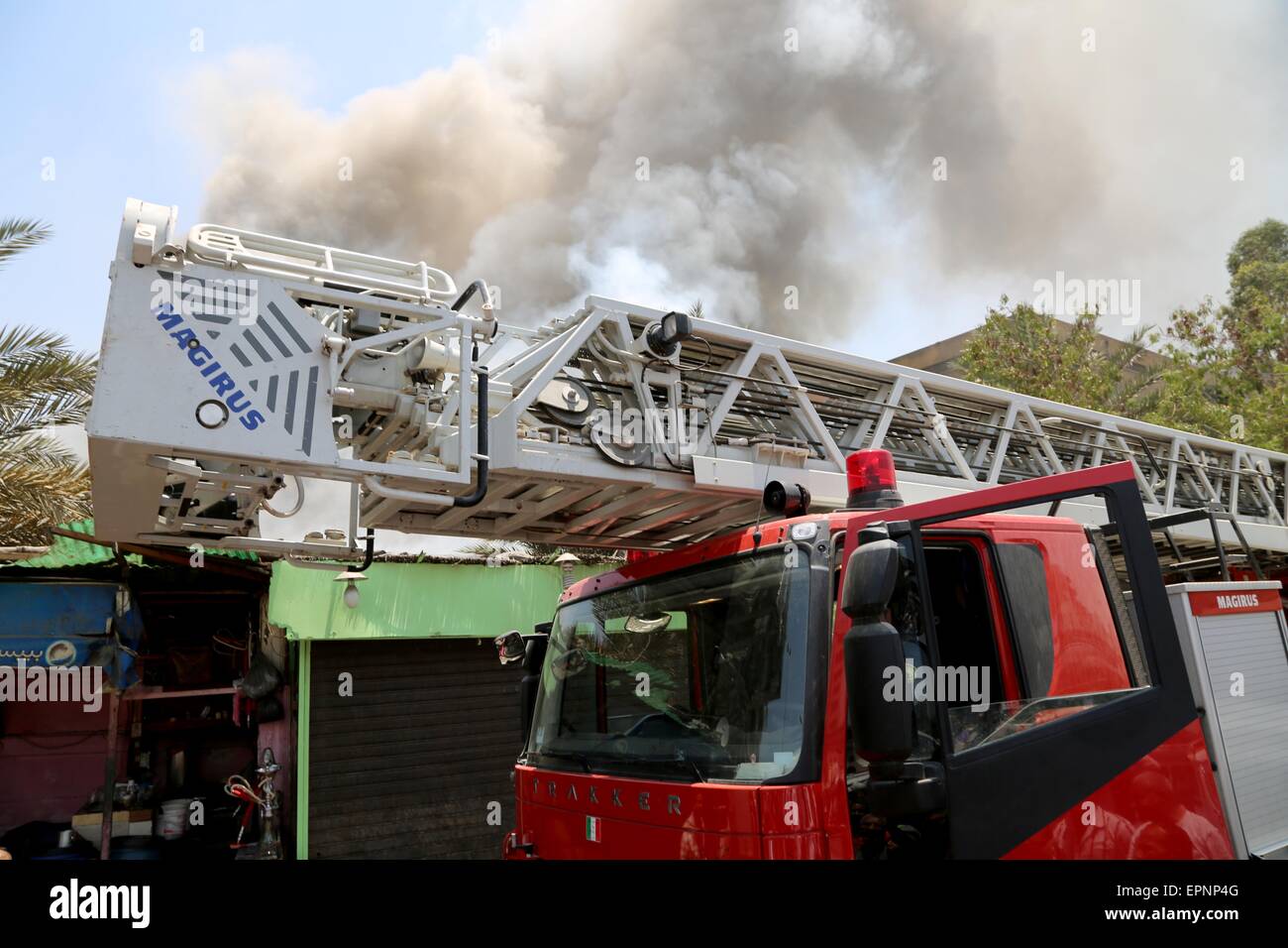 Cairo, Egypt. 20th May, 2015. Egyptian firefighters ride their vehicle ...