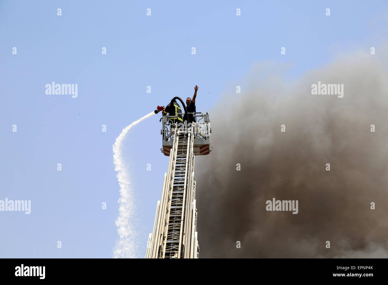 Cairo, Egypt. 20th May, 2015. Egyptian firefighters ride their vehicle ...