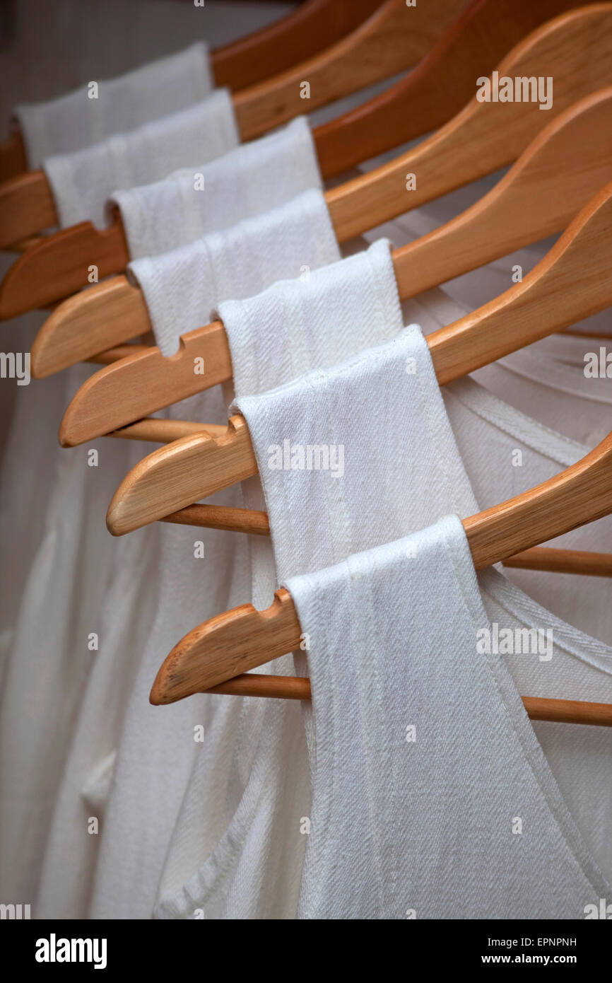 Hanging clothes on hangers in a fashion store Stock Photo - Alamy