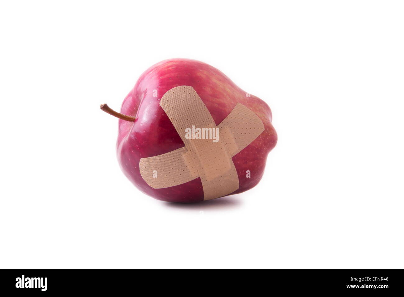 Isolated red delicious apple with band-aids Stock Photo - Alamy