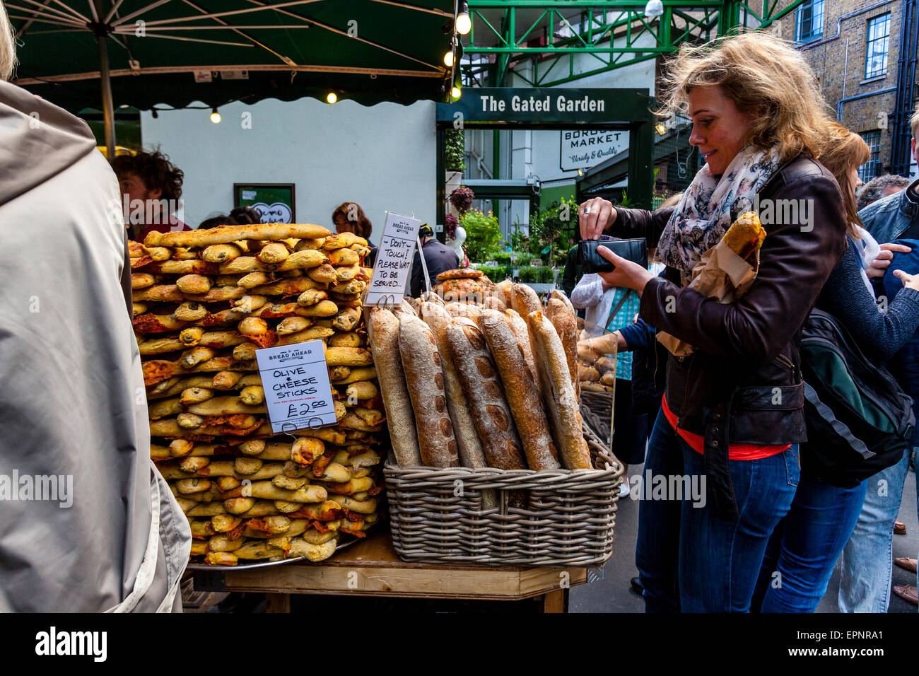 A Woman Buys Fresh Bread At Borough Market, London Bridge Area, London ...