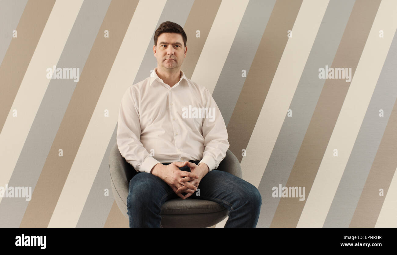 Man sitting chair hi-res stock photography and images - Alamy