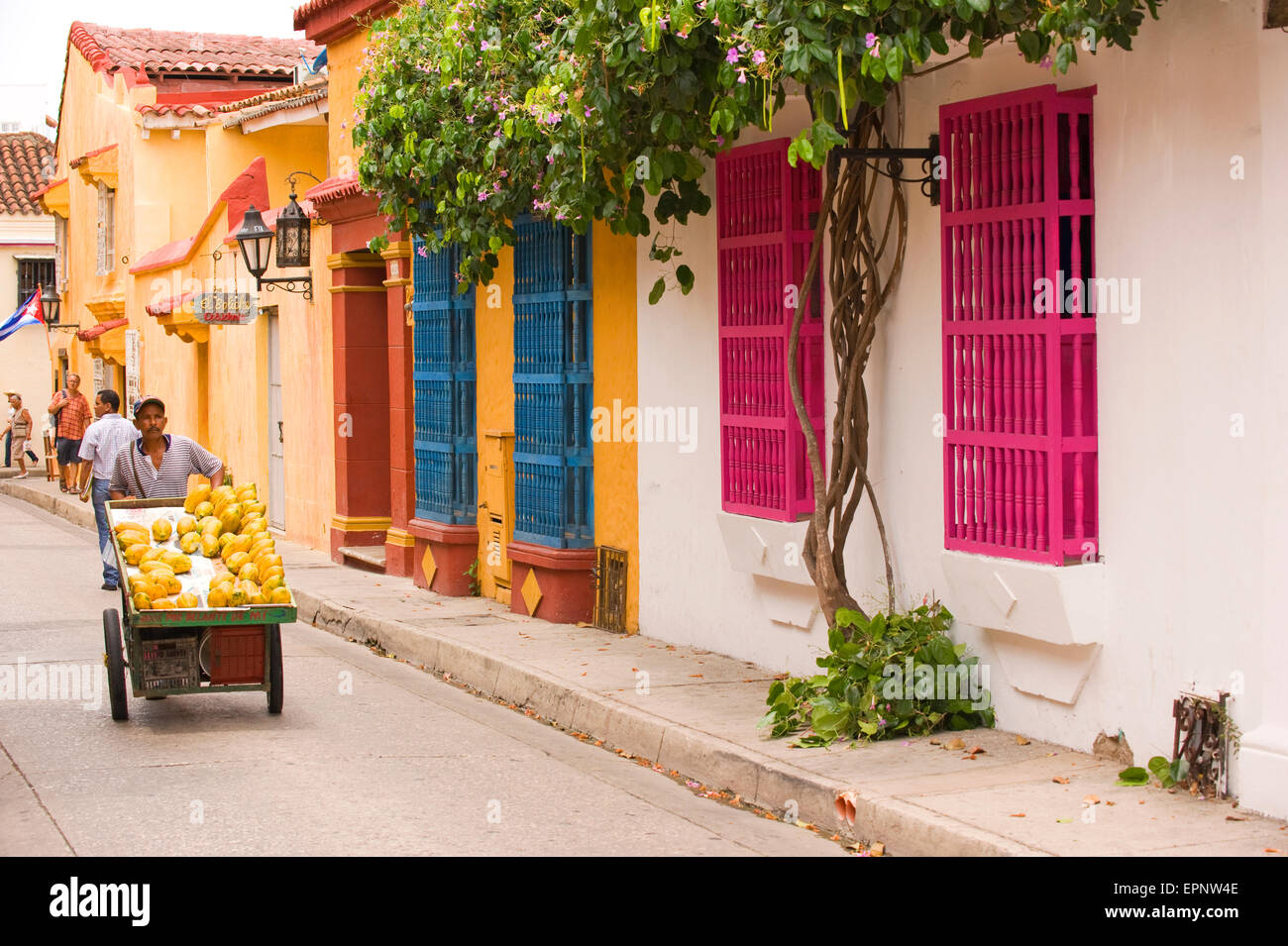 A street seller walking along a typical street in Cartagena, Colombia ...