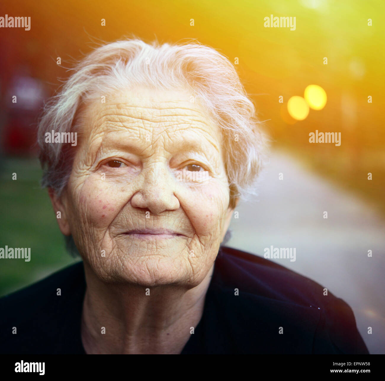 Portrait of happy older lady outdoors Stock Photo - Alamy