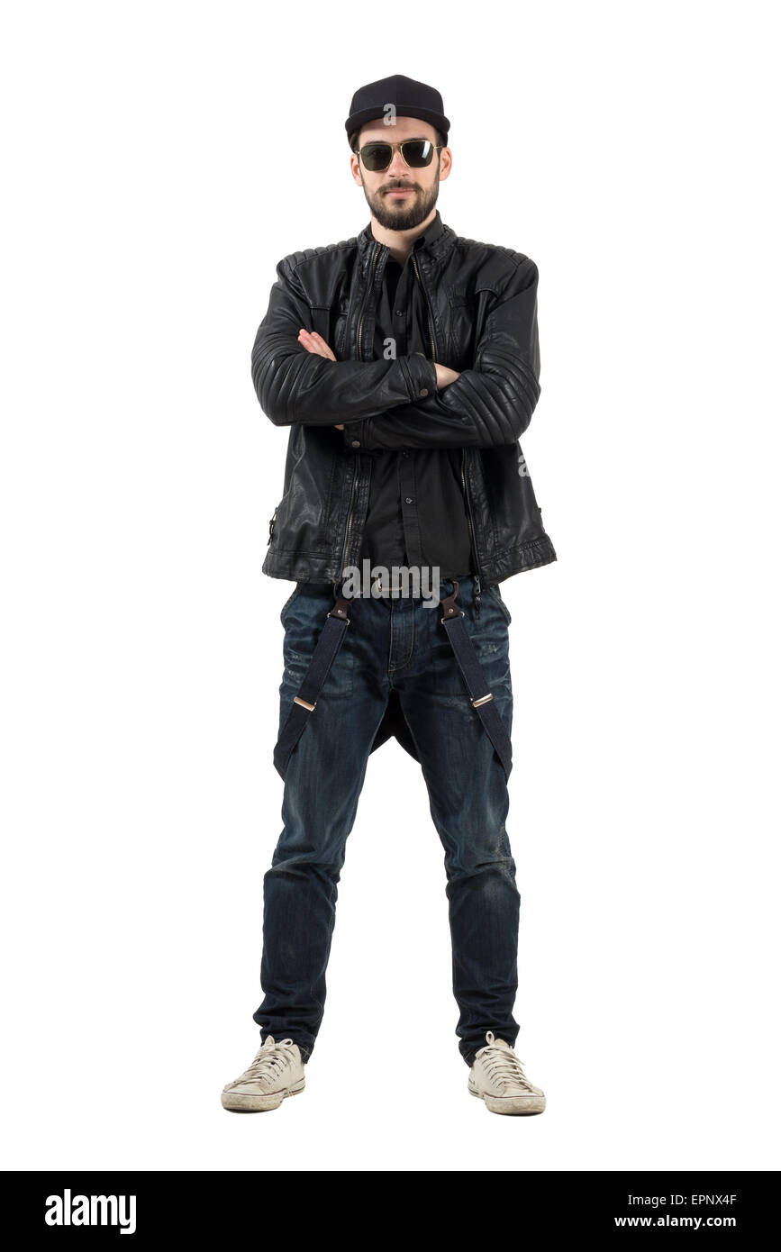 Young bearded man with sunglasses in baseball cap crossed arms. Full ...