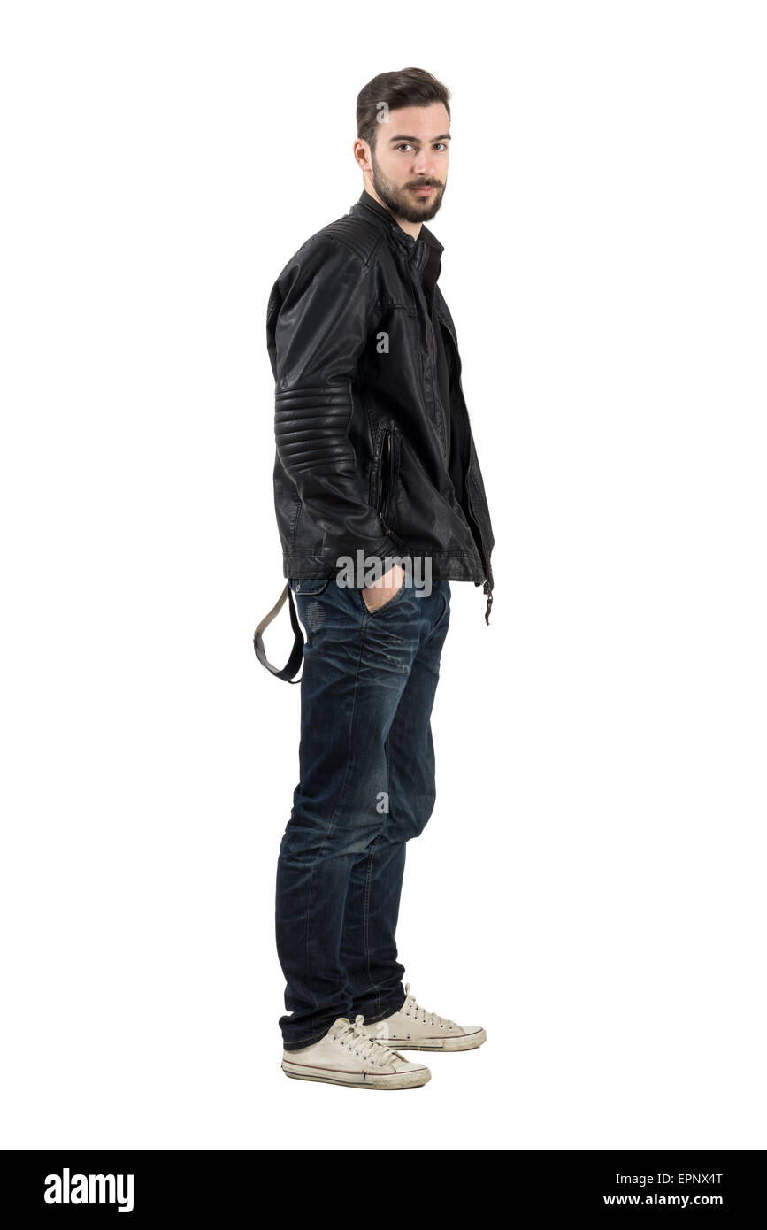 Side view of young fashion model in black leather jacket. Full body ...