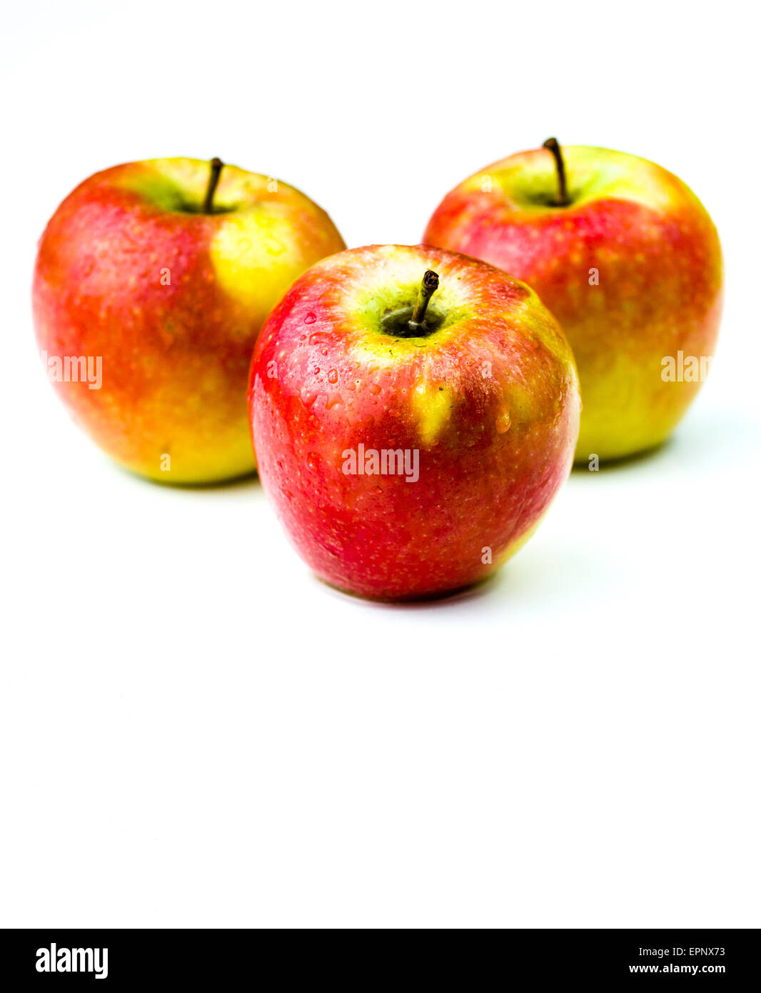 Studio shot of three delicious and healthy apples on a white background ...