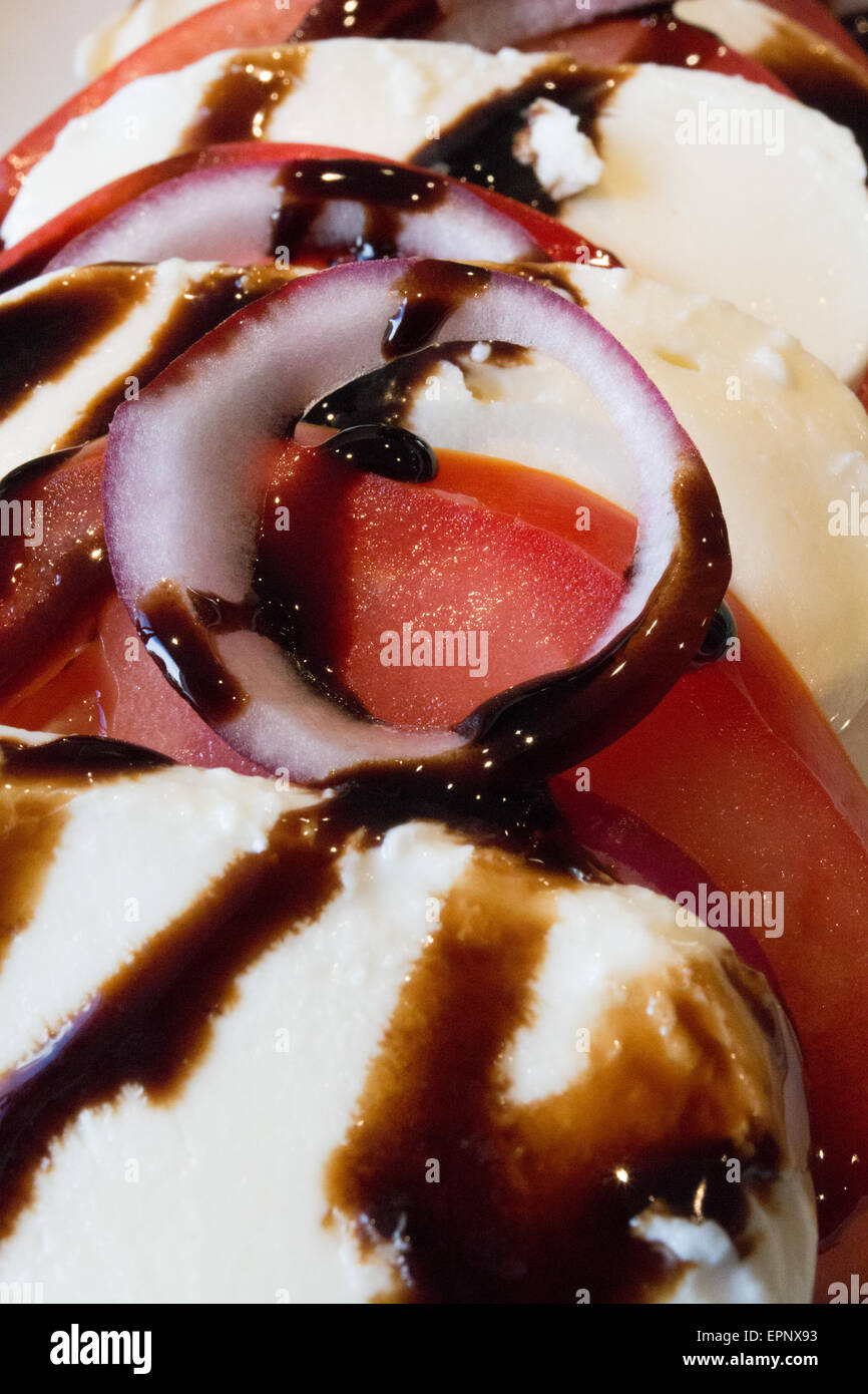 Buffalo mozarella cheese with red onion salad Stock Photo - Alamy