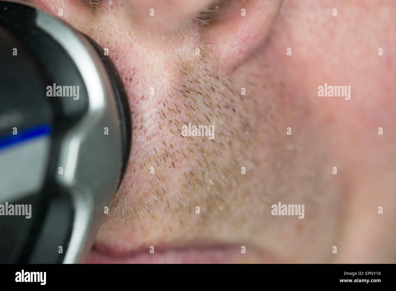 man using electric shaver Stock Photo - Alamy