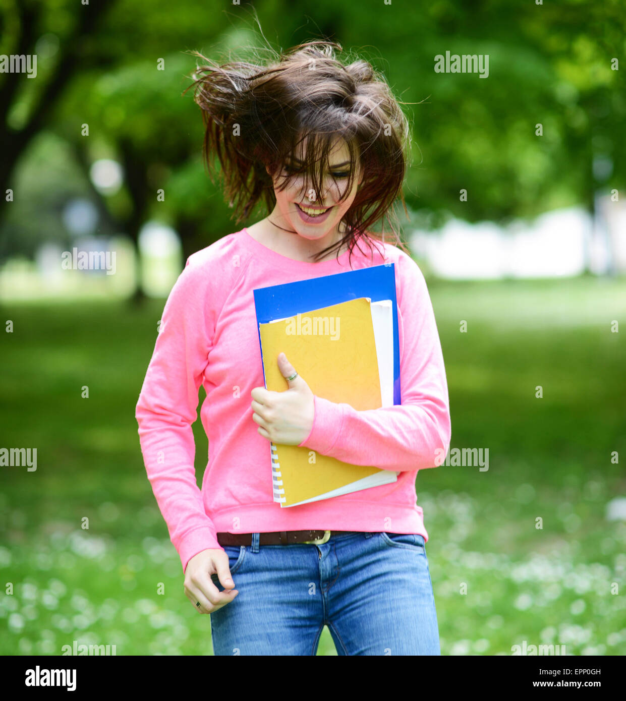Happy student girl jumping for joy after passed exam Stock Photo - Alamy