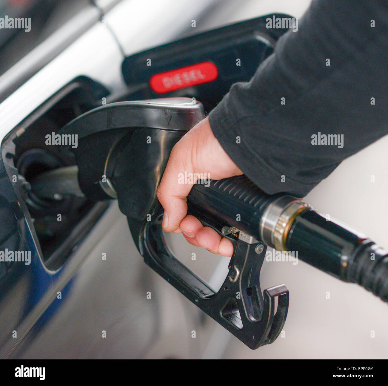 Pumping gas at gas pump Stock Photo - Alamy