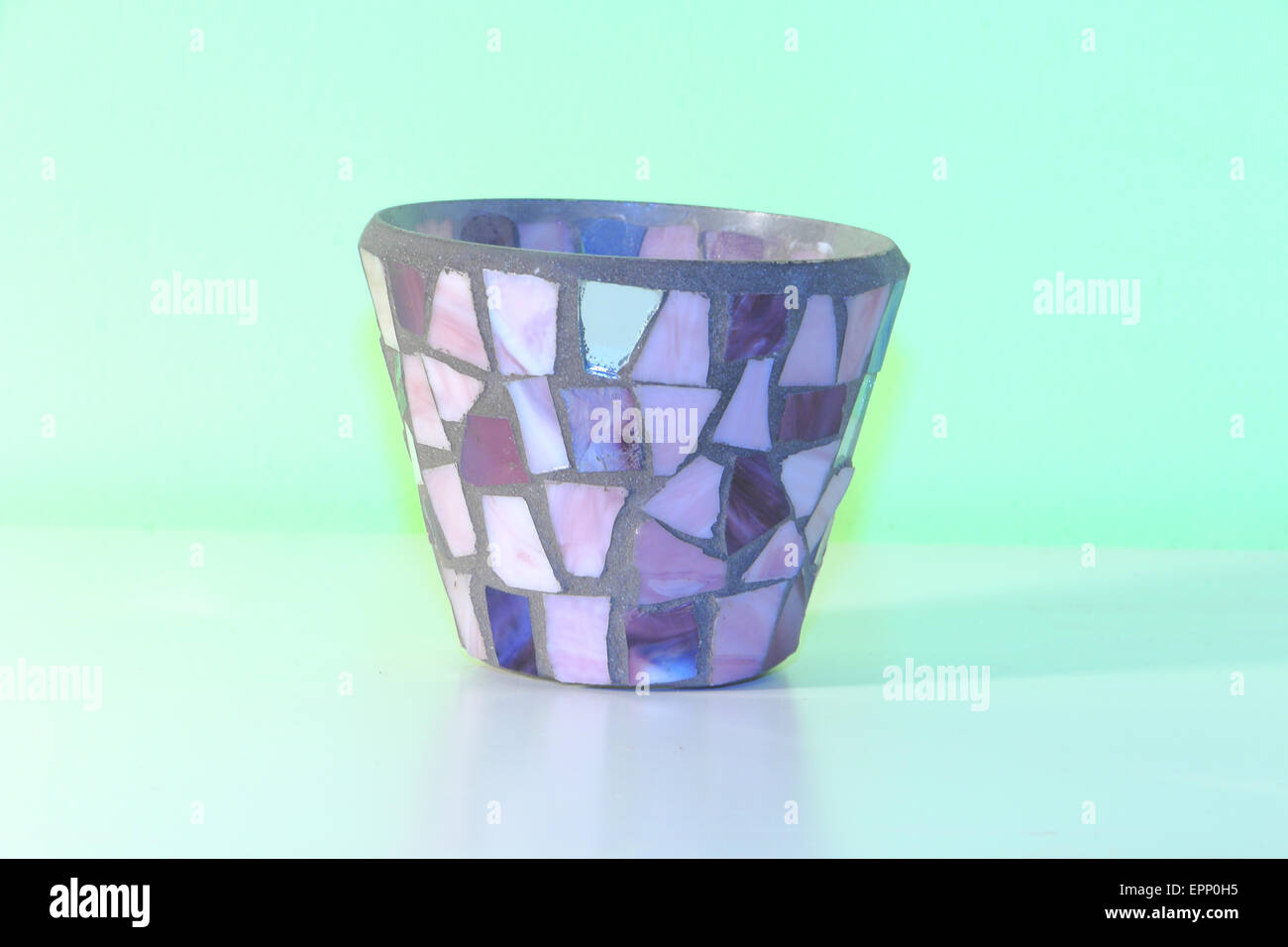 A stained glass cup - purple and pink with green background Stock Photo ...