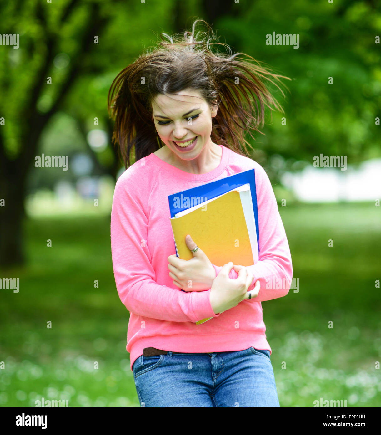Happy student girl jumping for joy after passed exam 4 Stock Photo - Alamy
