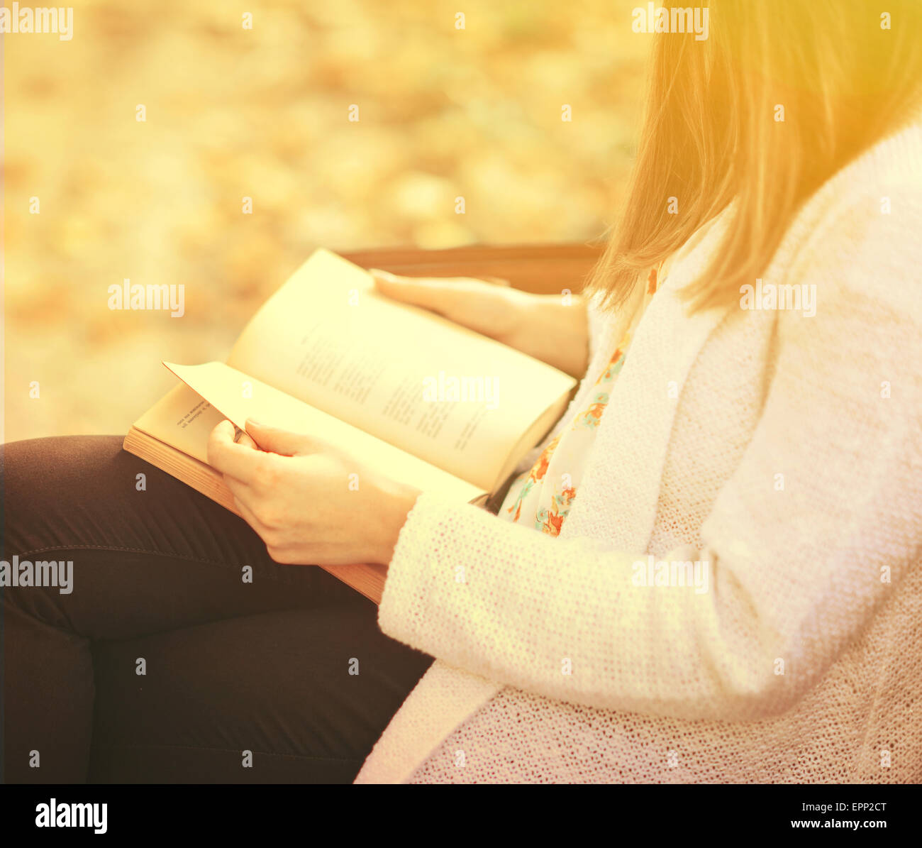 Girl reading book outdoor learning hi-res stock photography and images ...