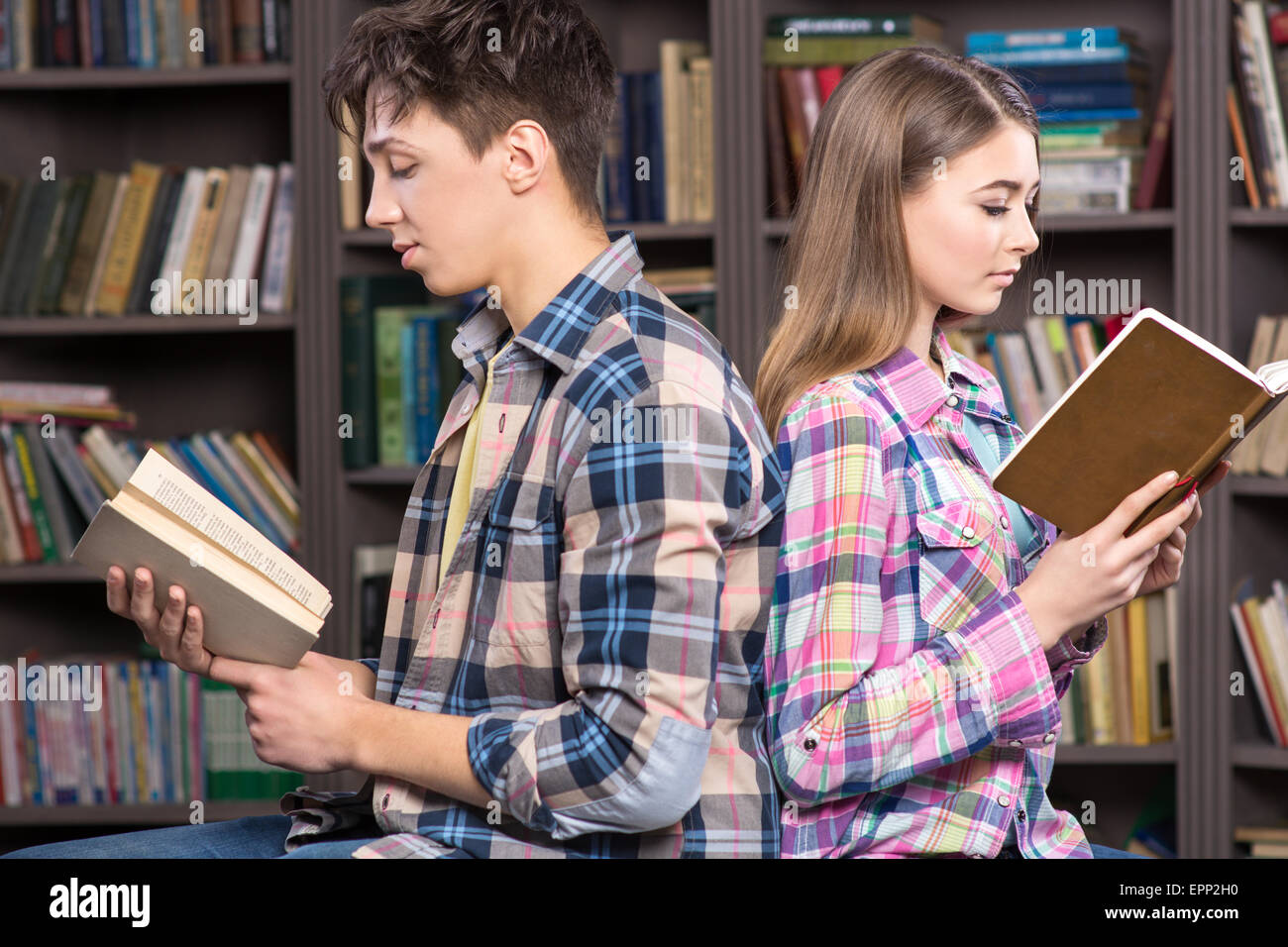 Concept for teenagers in library Stock Photo - Alamy
