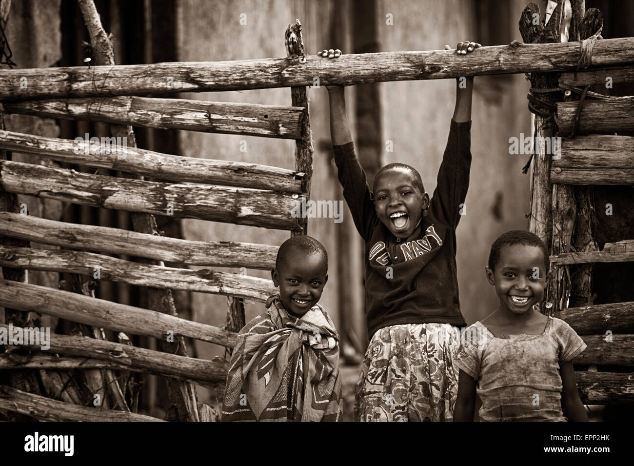 Swinging, smiling African children in monochrome Stock Photo - Alamy