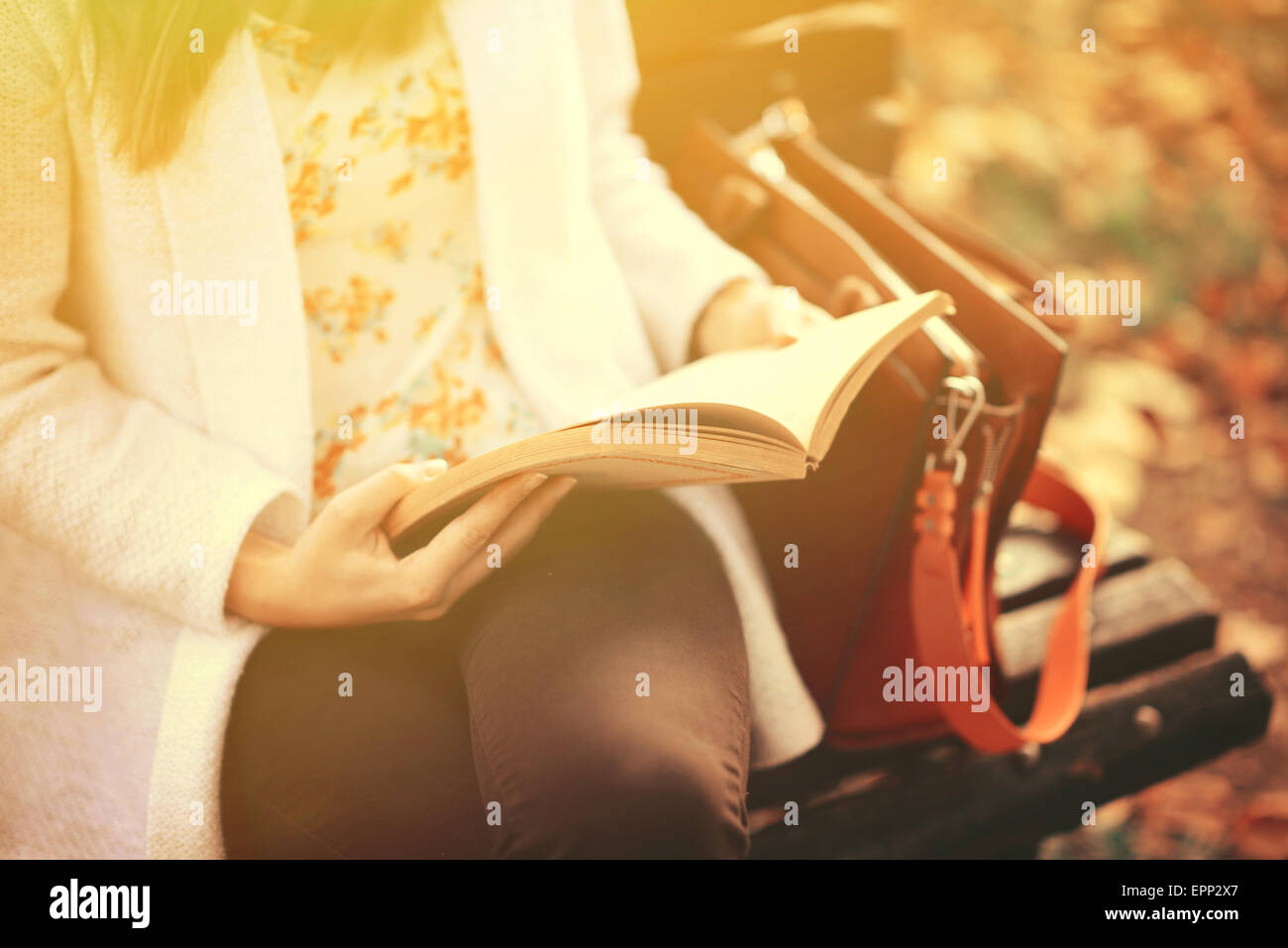 Girl reading book outdoor learning hi-res stock photography and images ...