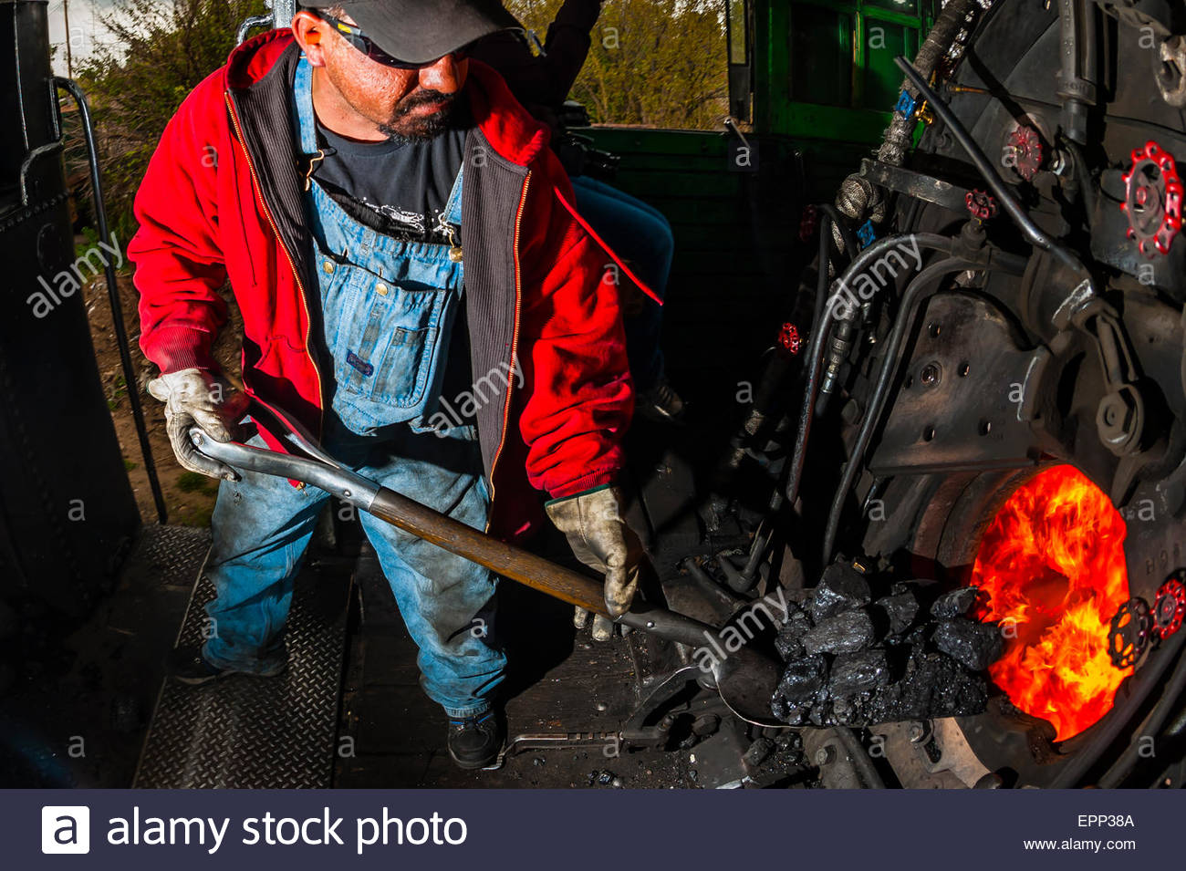 Man Stoking Fire Stock Photos & Man Stoking Fire Stock Images - Alamy