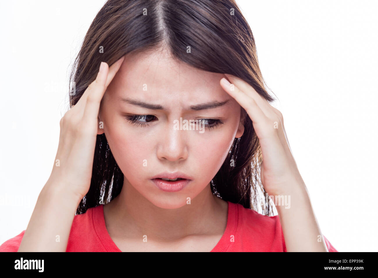 Chinese woman with headache, putting hands on temples Stock Photo - Alamy