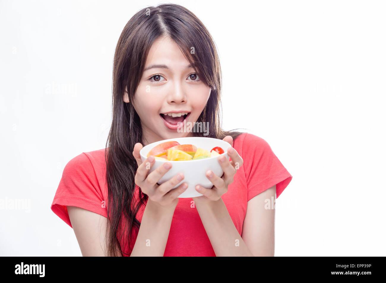 Healthy Chinese woman holding bowl of fruit Stock Photo - Alamy