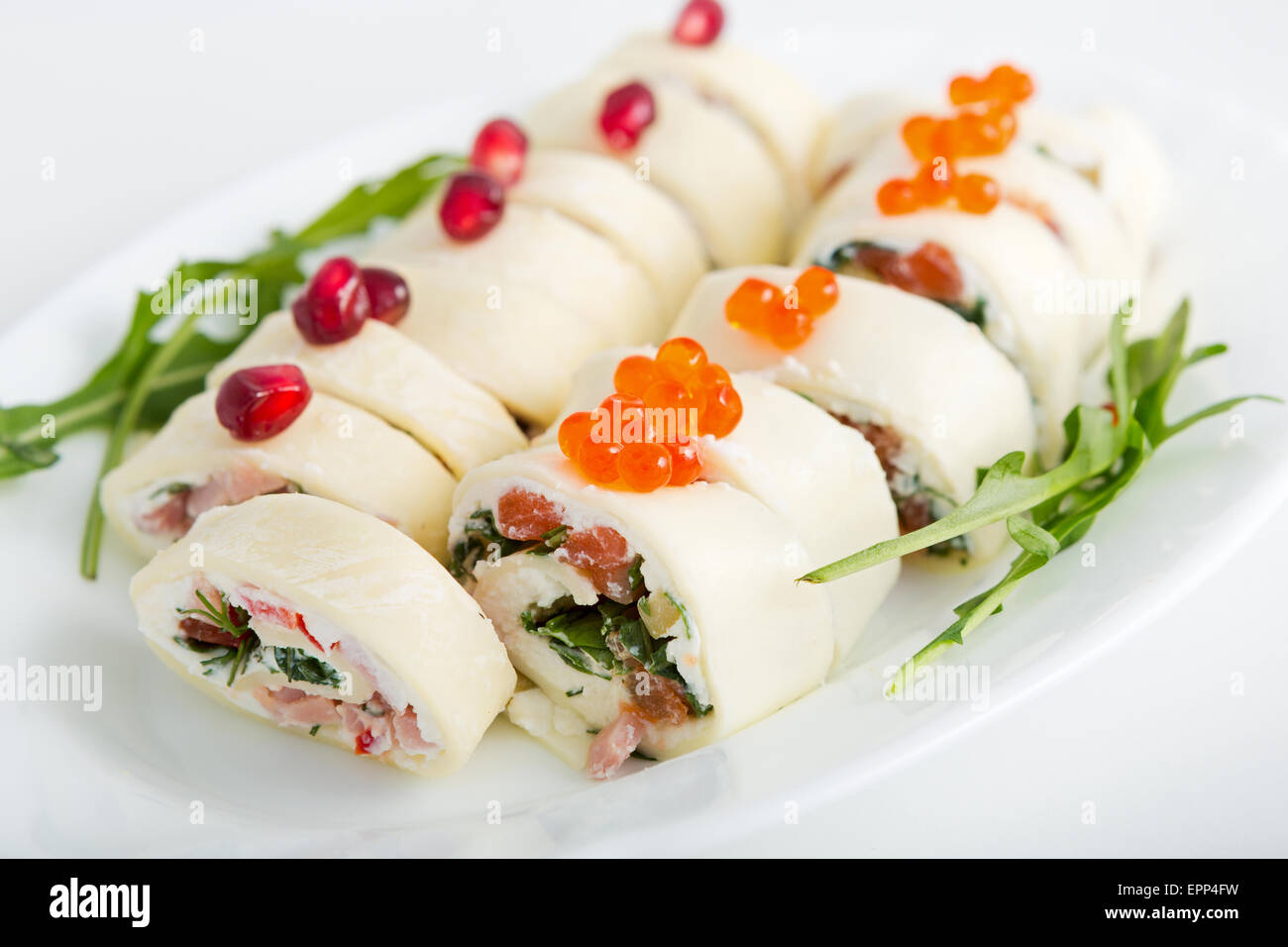 Cheese rolls with ham and red fish, on a white background Stock Photo ...