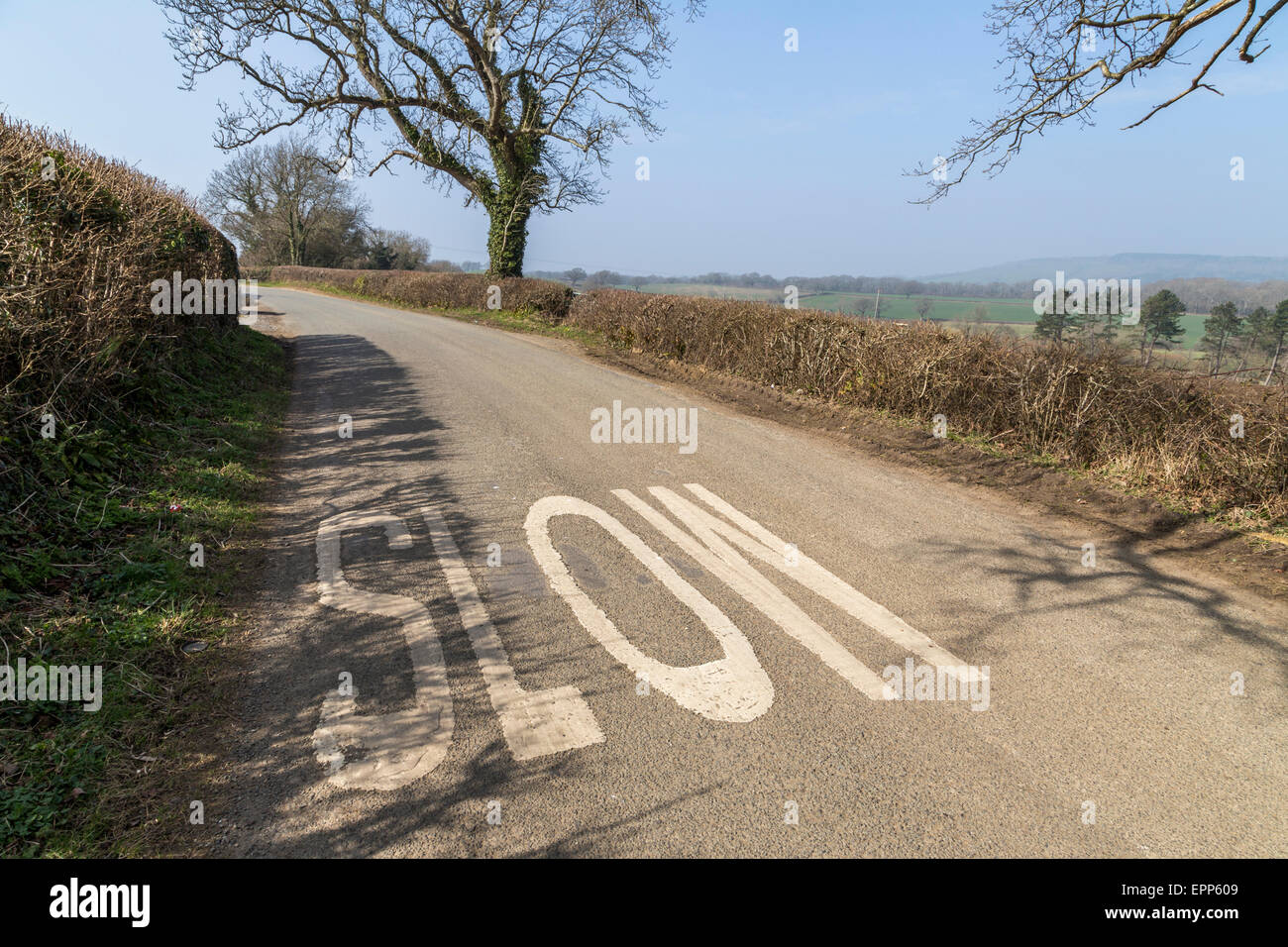 Road marking slow sign painted hi-res stock photography and images - Alamy