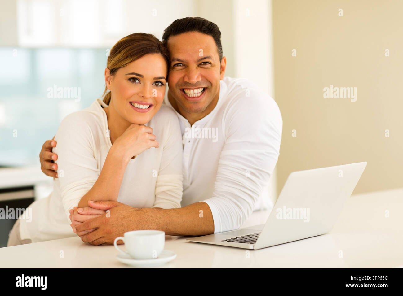lovely couple with laptop computer at home Stock Photo - Alamy